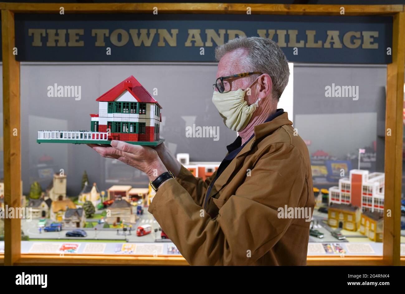Greg Hoar holds a Bayko model house during a preview for 'Life before ...