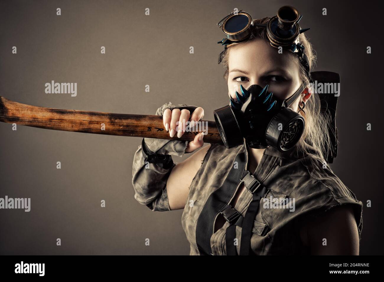 brutal woman in a steampunk mask and ax in hands Stock Photo - Alamy