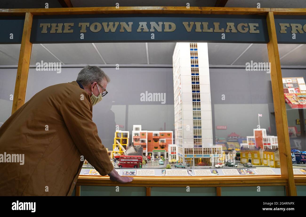 Greg Hoar looks at a display case featuring Arkitex and Spot-On models ...