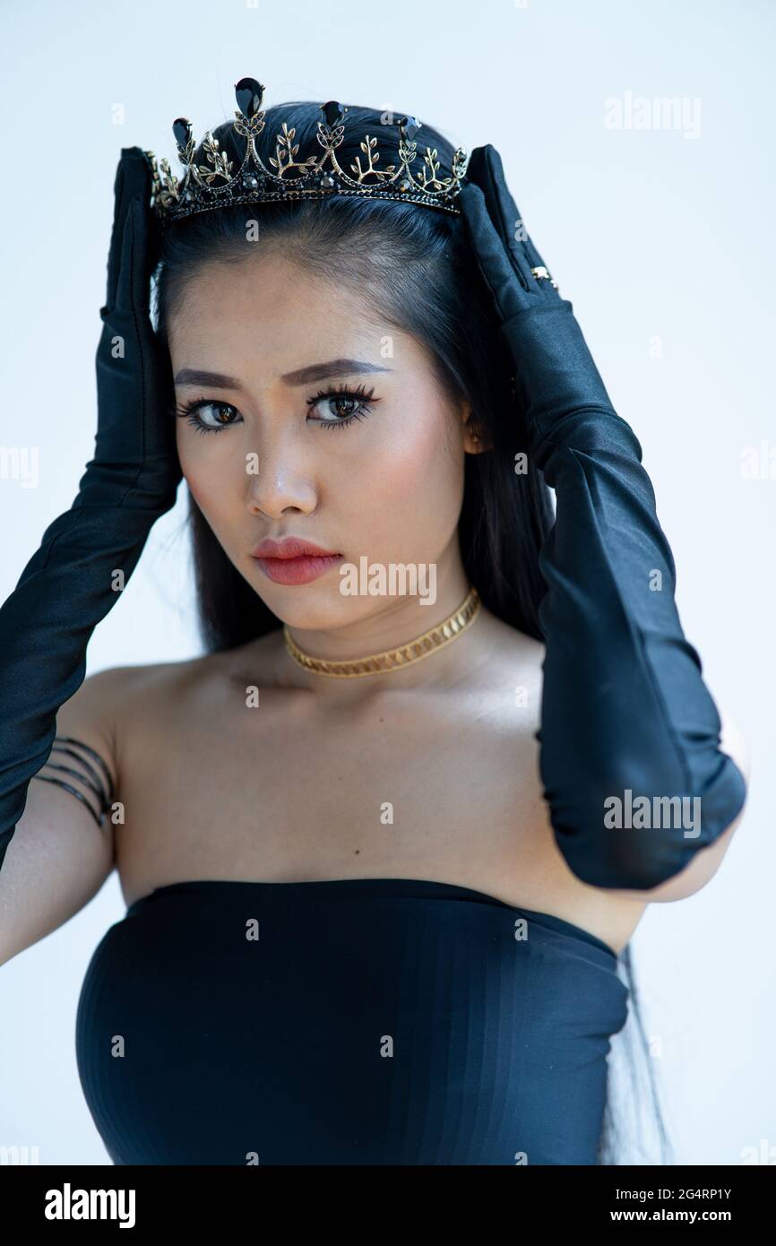 Dark hair asian girl wearing crown Stock Photo - Alamy