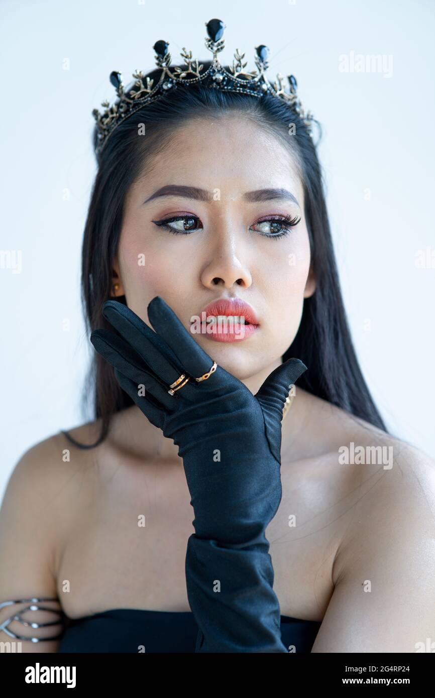 Dark hair asian girl wearing crown Stock Photo - Alamy