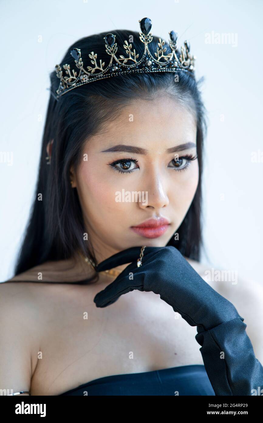 Dark hair asian girl wearing crown Stock Photo - Alamy
