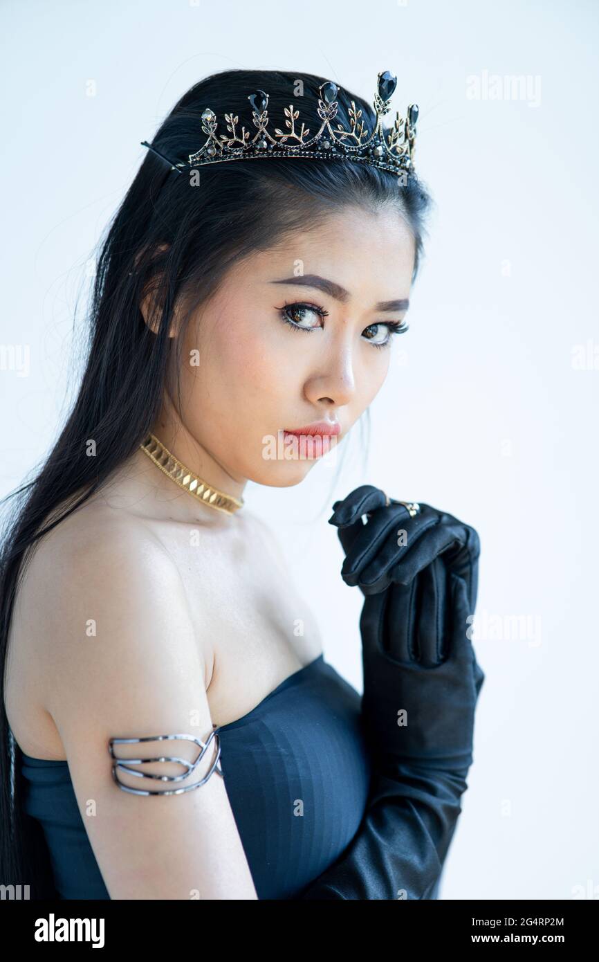 Dark hair asian girl wearing crown Stock Photo - Alamy