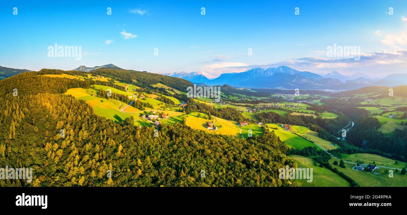 Green meadows, alpine houses and mountain peaks, Salzburger area ...