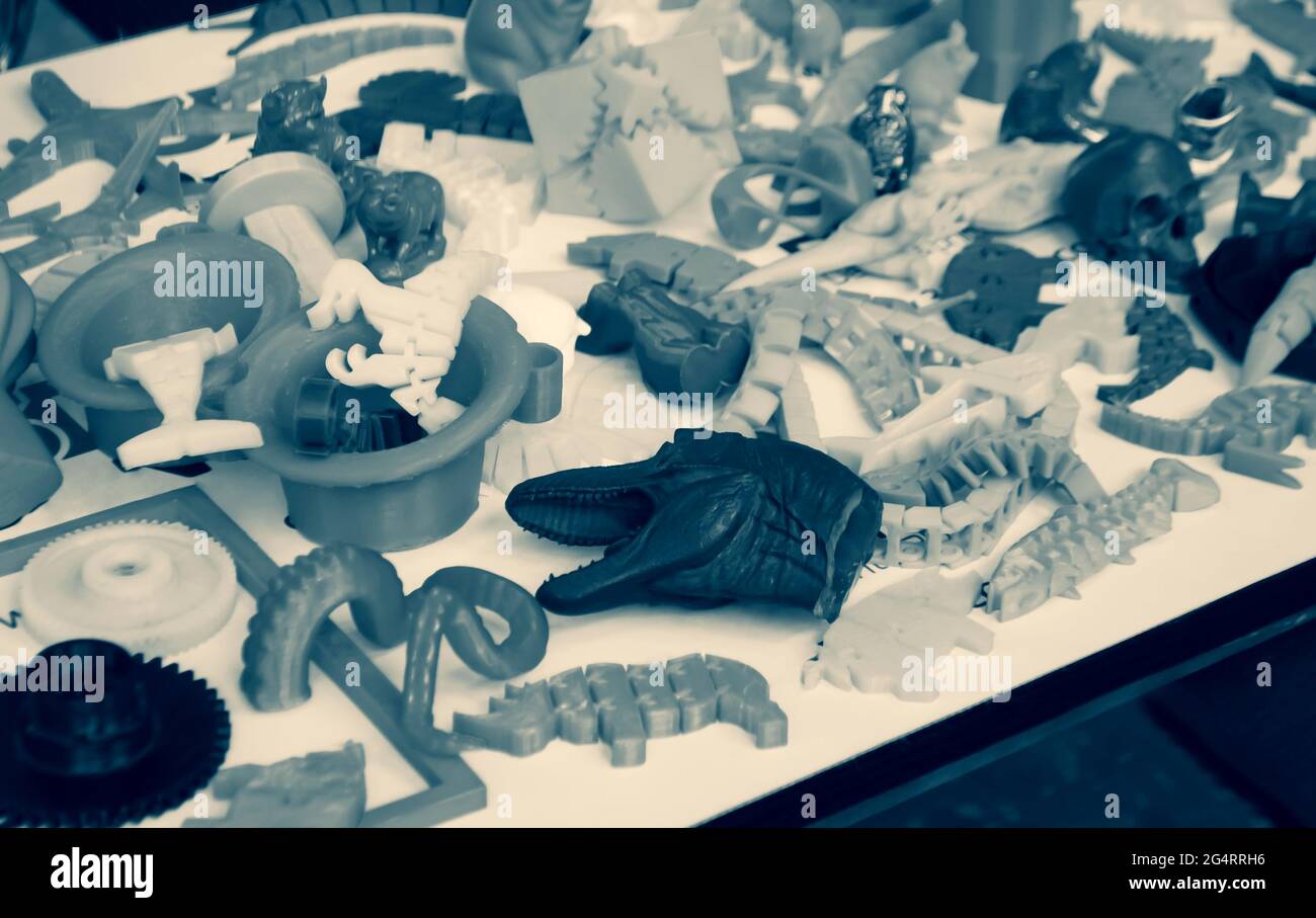 Models printed by 3d printer. Bright colorful objects printed on a 3d ...