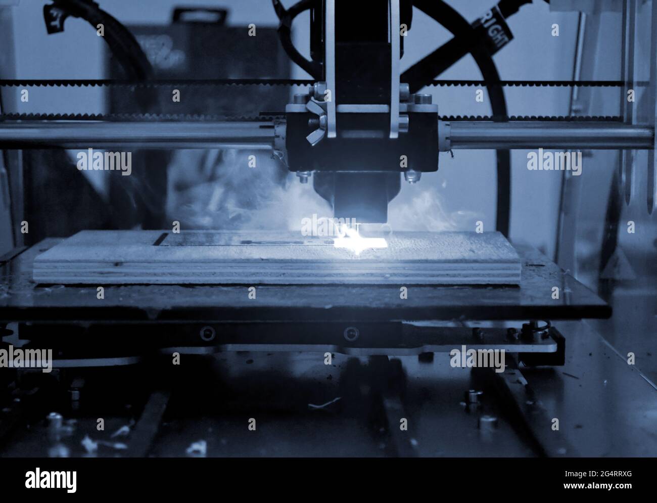 Laser engraving on wood close-up. 3D printer laser beam Stock Photo - Alamy