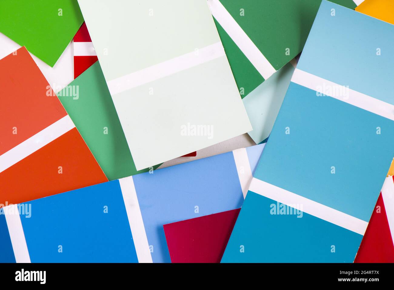 Closeup of a pile of color charts with a big variety of colors ranging ...