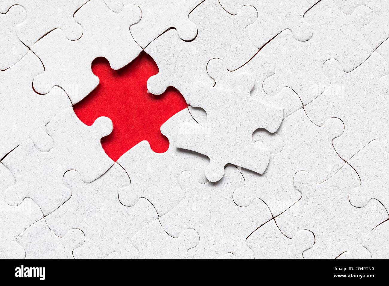 Unfinished white jigsaw puzzle pieces. Fill in pieces of the jigsaw ...