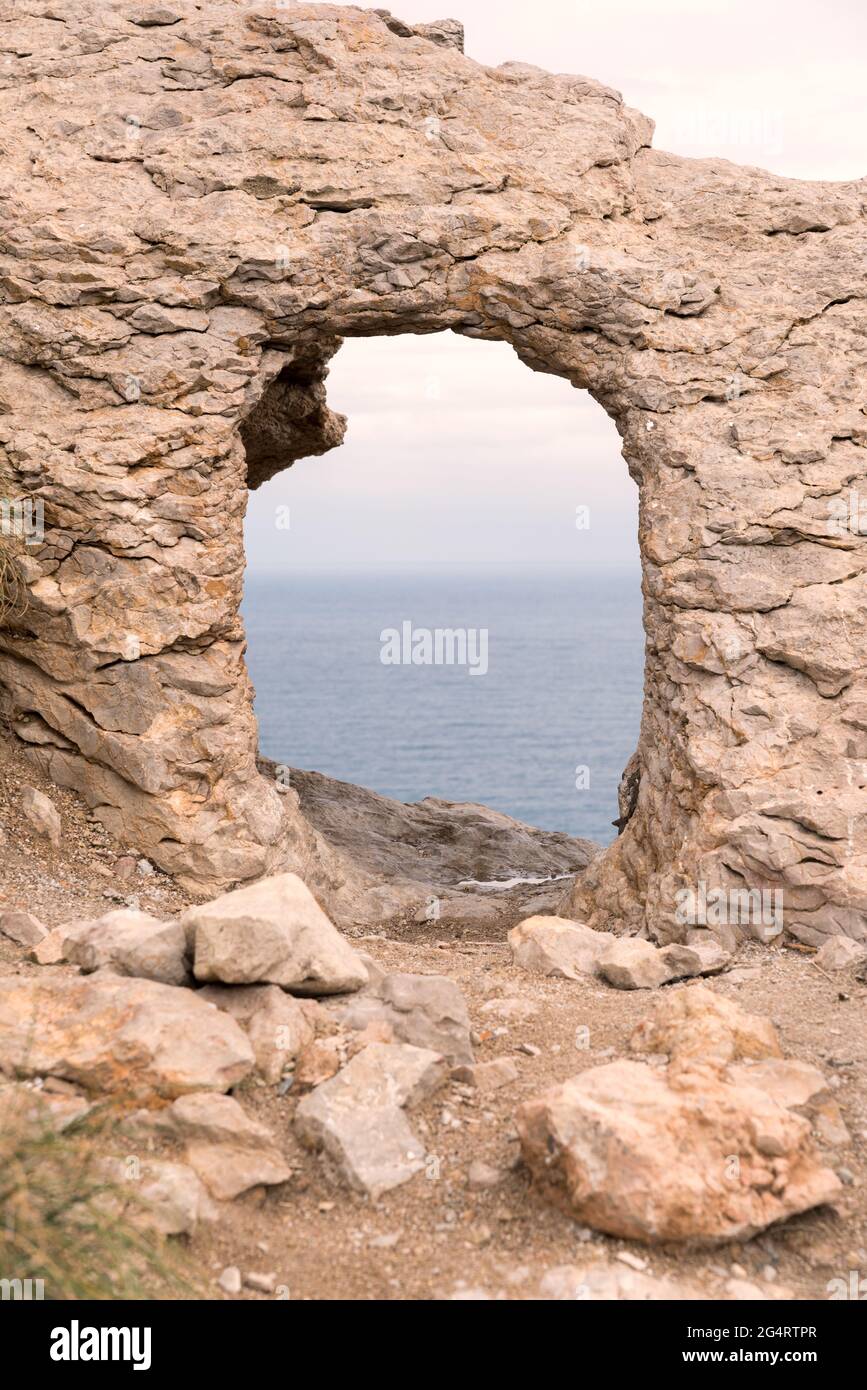 Natural hole that has been produced in the rock by the effect of wind ...