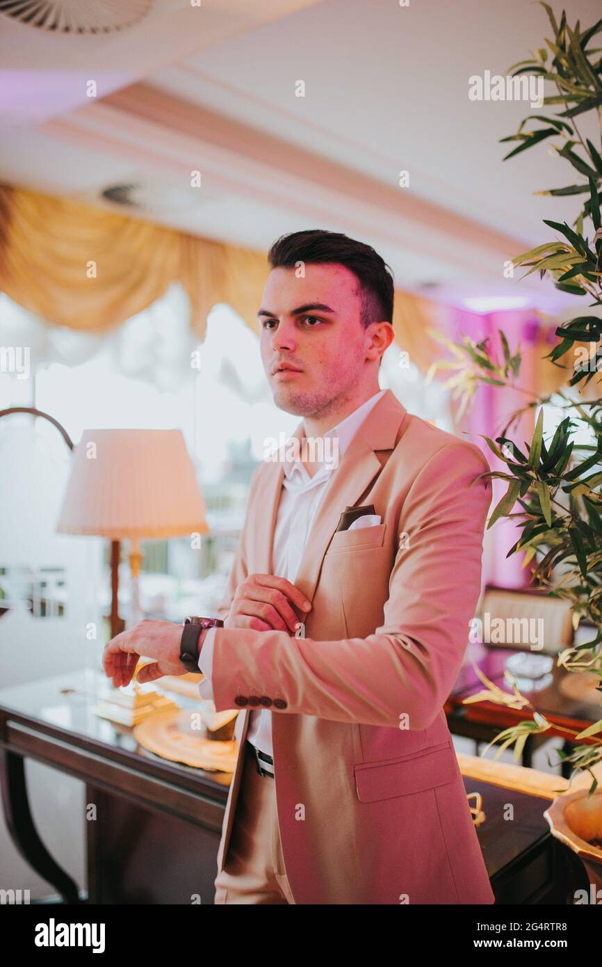 Caucasian young businessman in a suit standing in the restaurant Stock ...