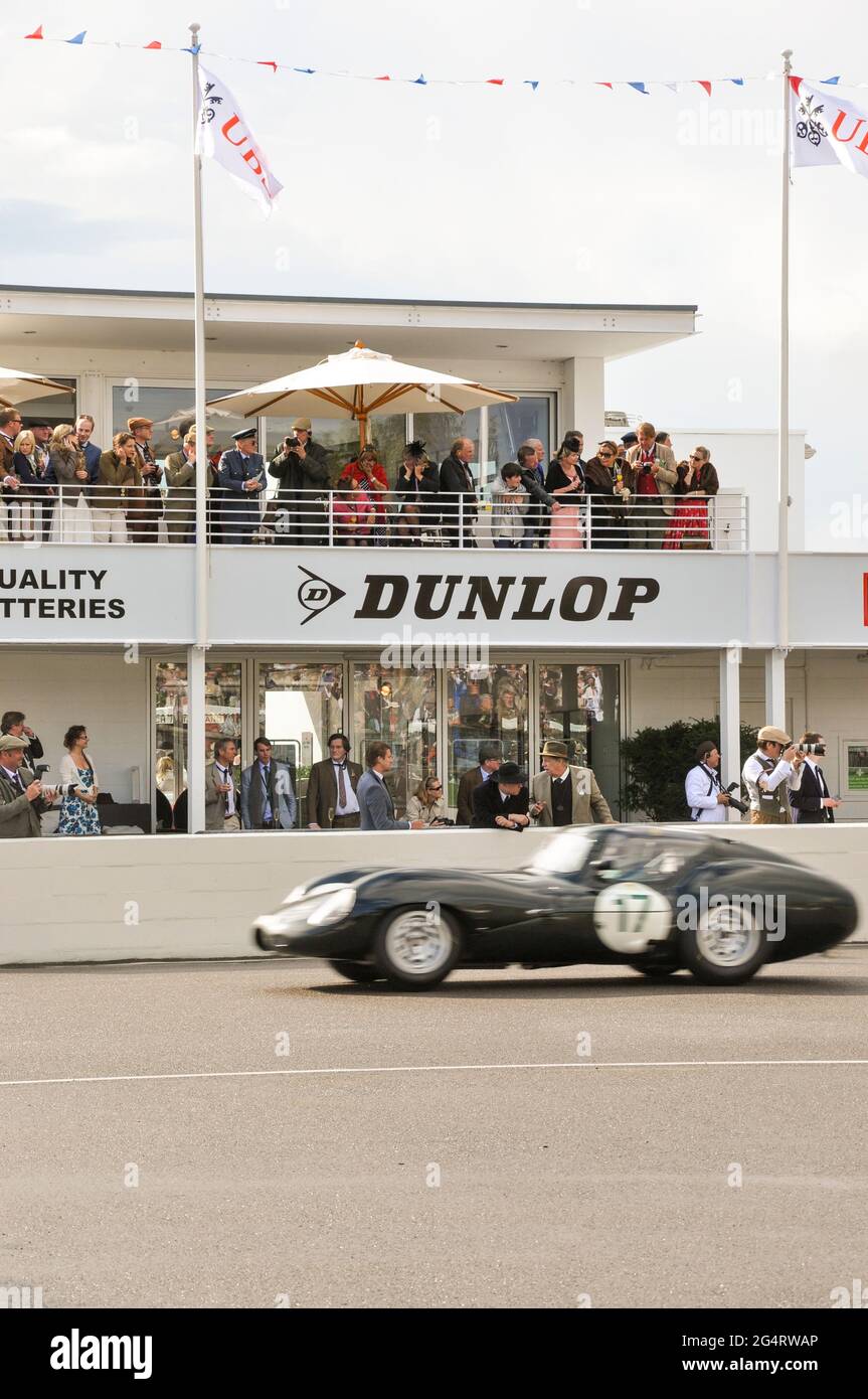 Classic motor racing car passing the historic circuit's pit area at ...