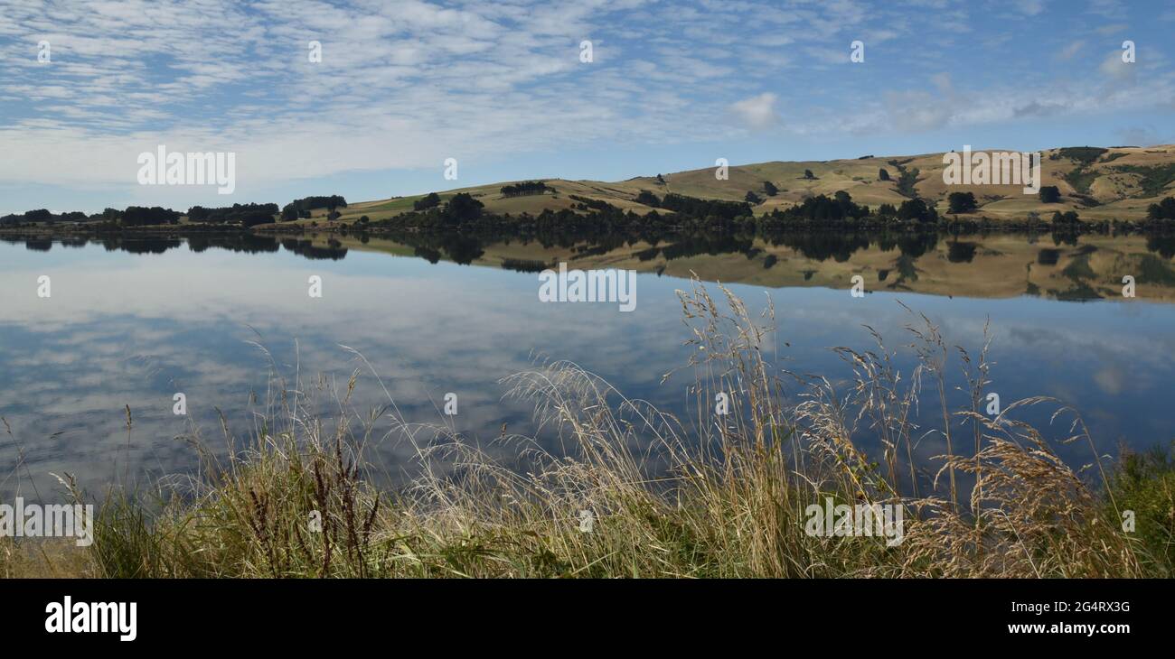 reflections in lake caitlin Stock Photo - Alamy