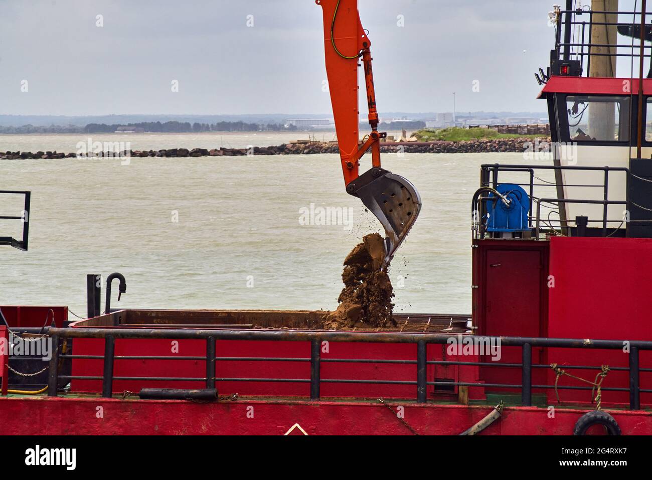 Close up of sand and mud being loaded into a ship's hopper Stock Photo ...
