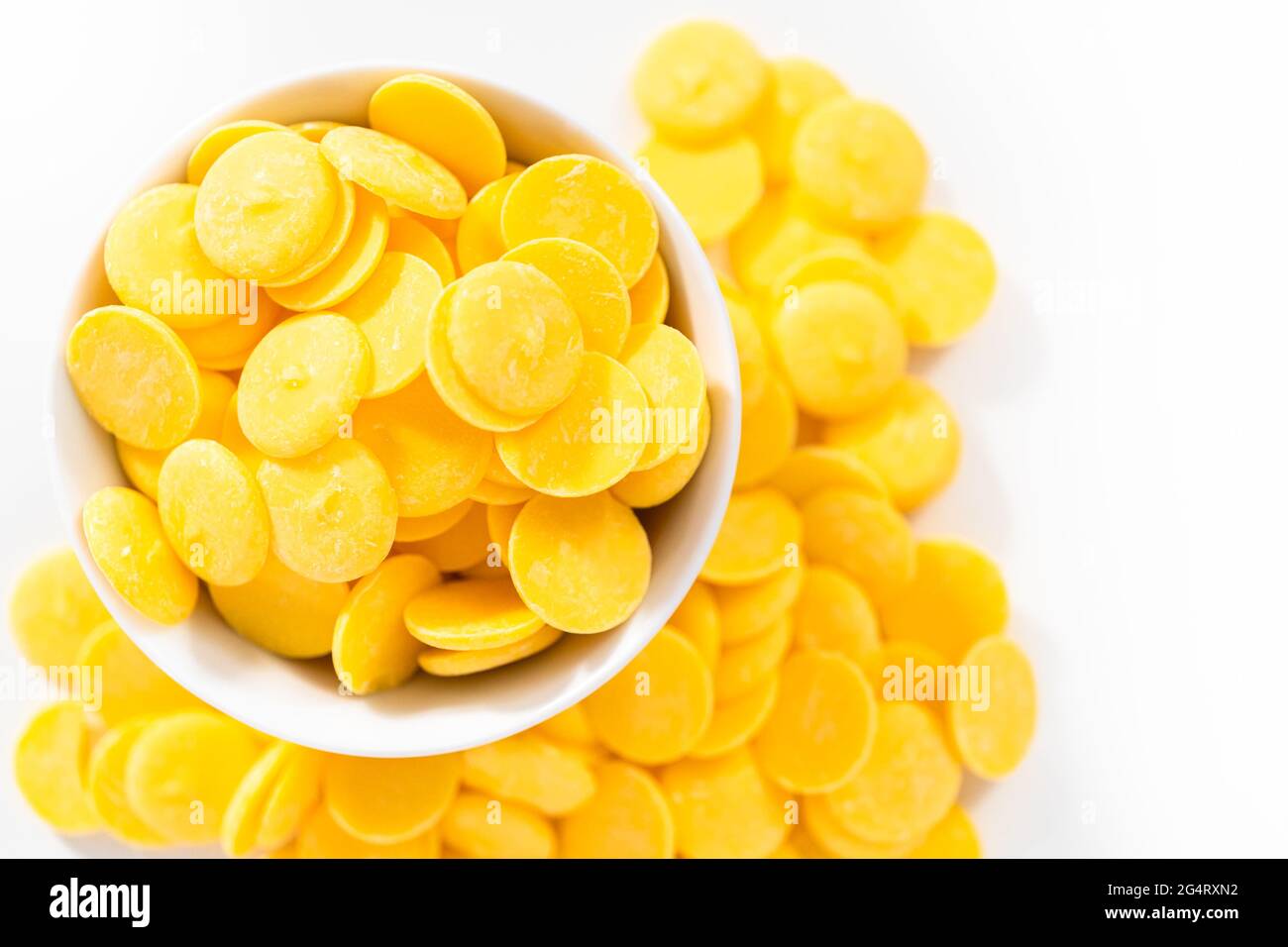 Yellow round chocolate chips for melting chocolate shapes Stock Photo ...