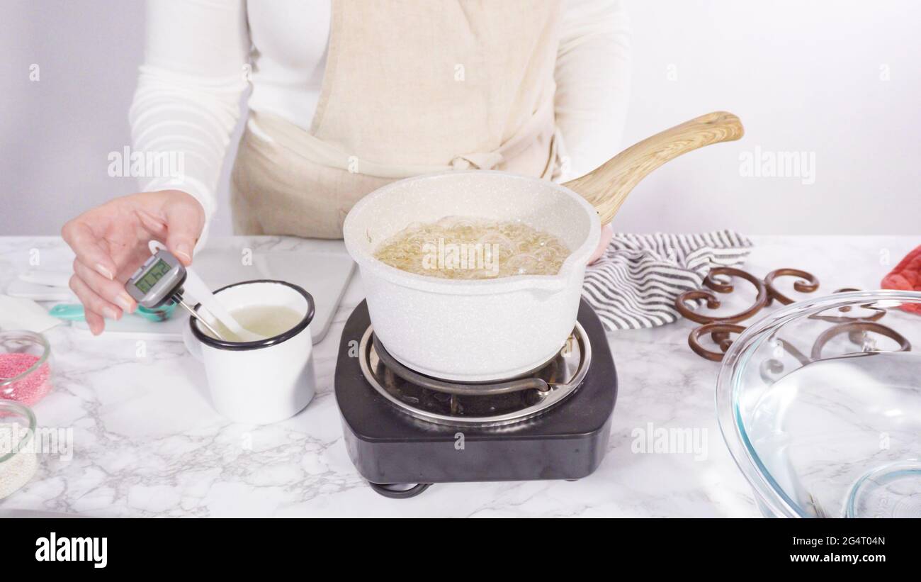 Step by step. Caramelizing sugar in a small cooking pot over the small ...