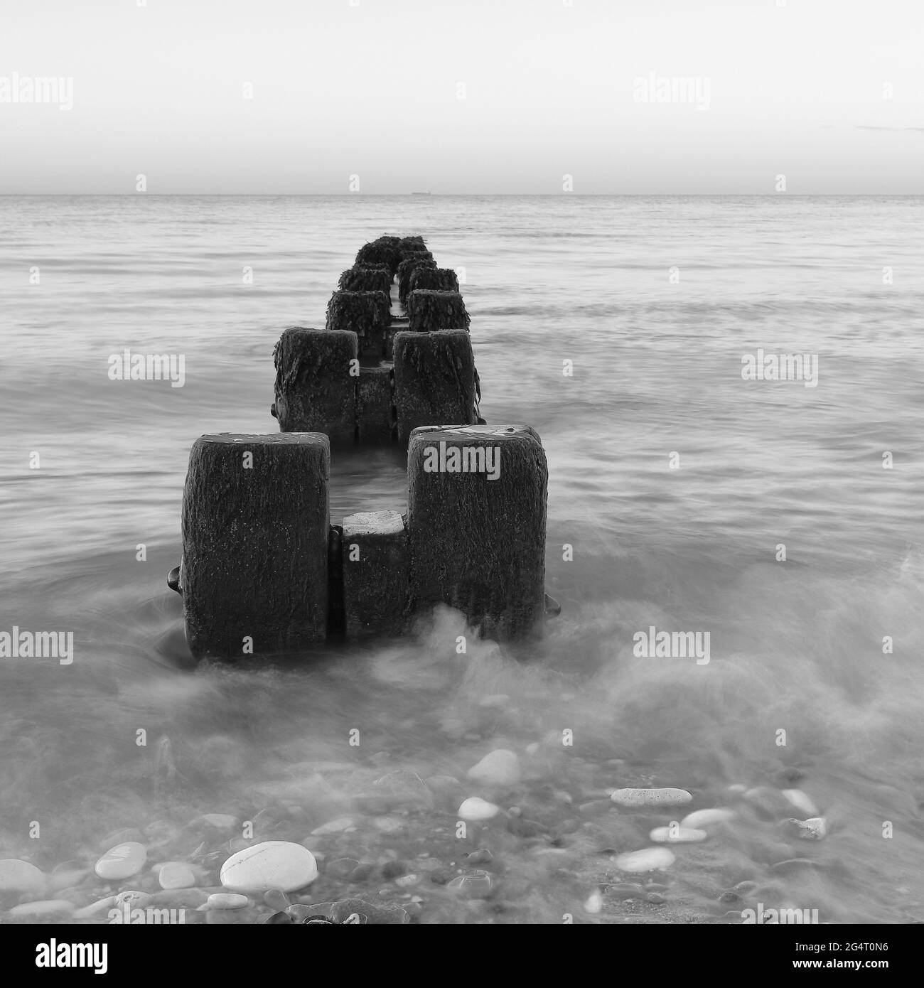Black and white photograph of groynes at the north beach in Bridlington ...