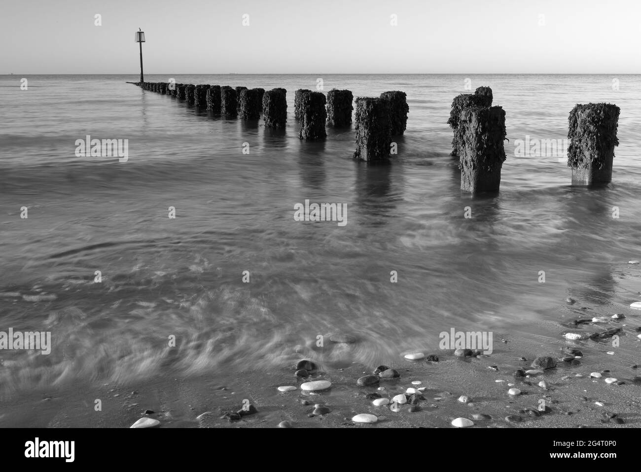 Black and white photograph of groynes at the north beach in Bridlington ...