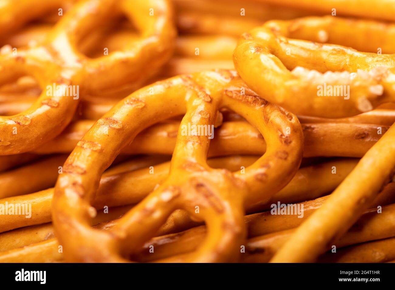 Bread sticks and bread figures with salt. Close-up Background image ...