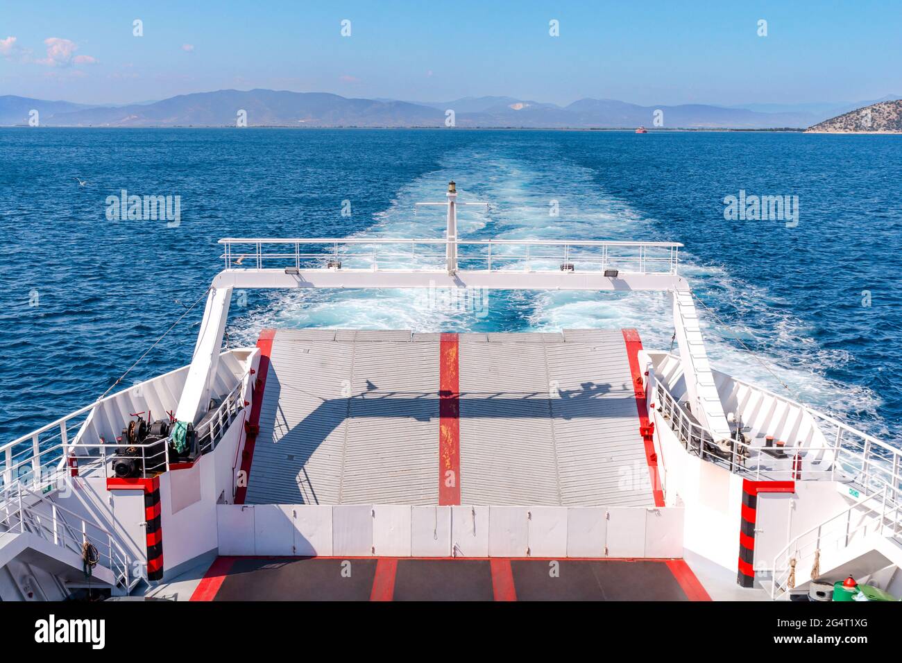 Back side of big ferry boat in the Mediterranean sea with blue sky ...