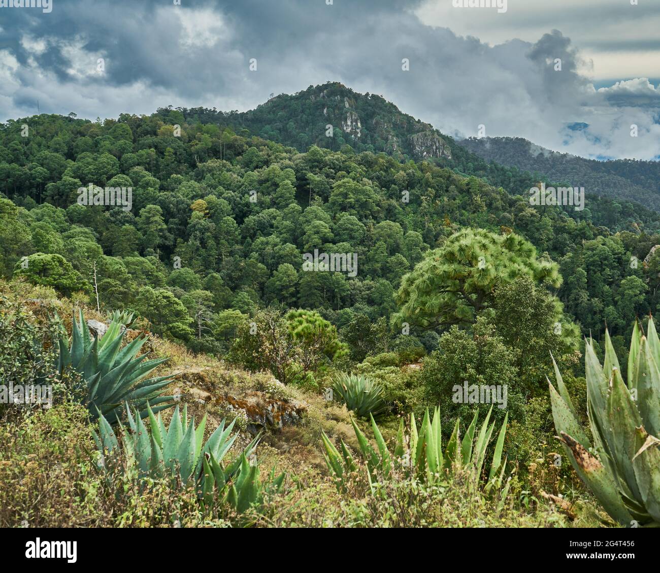 Clear landscape with mountains and clouds on a cool day Stock Photo - Alamy
