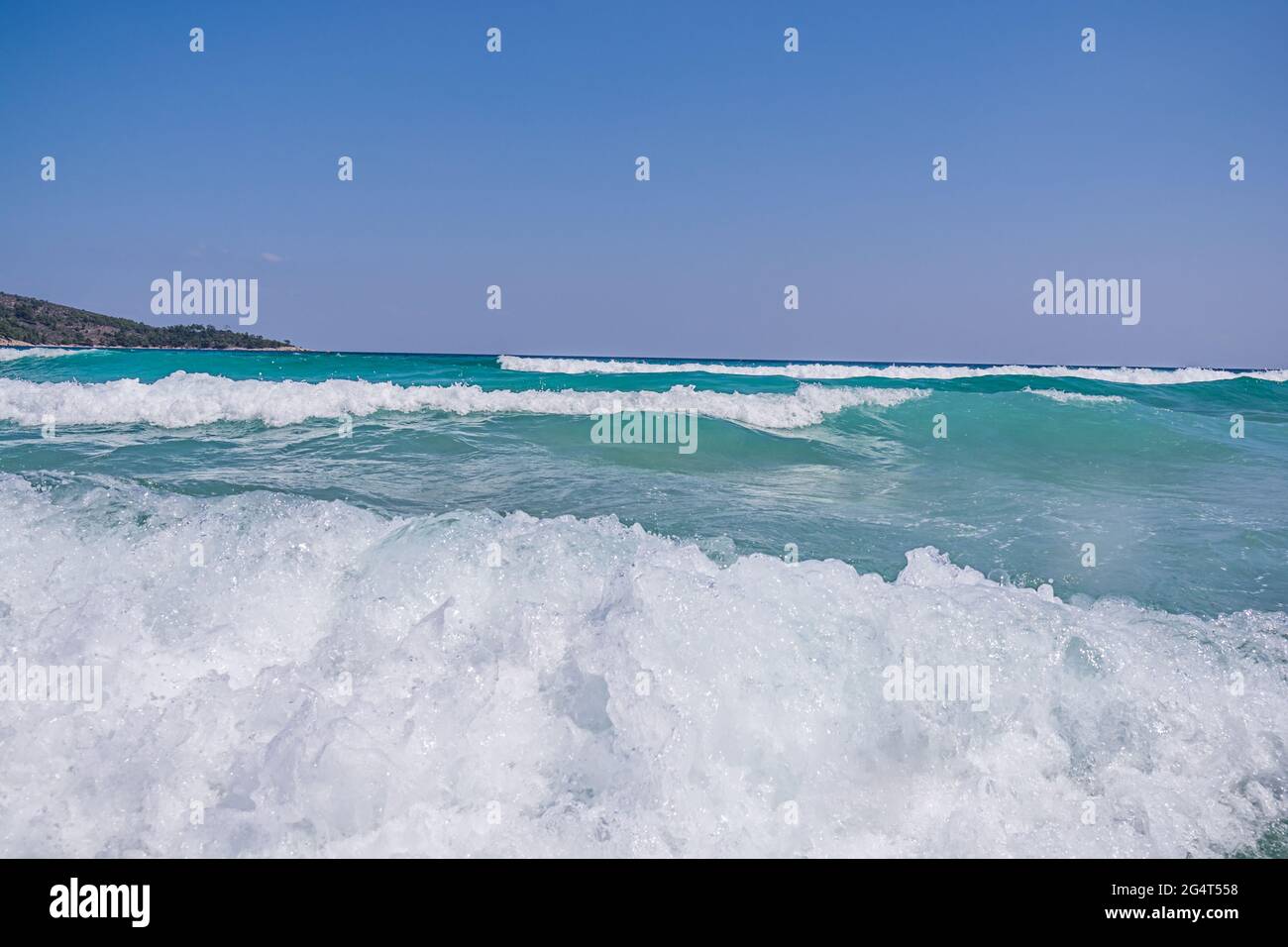 Big sea water wave with clean blue sky Stock Photo - Alamy