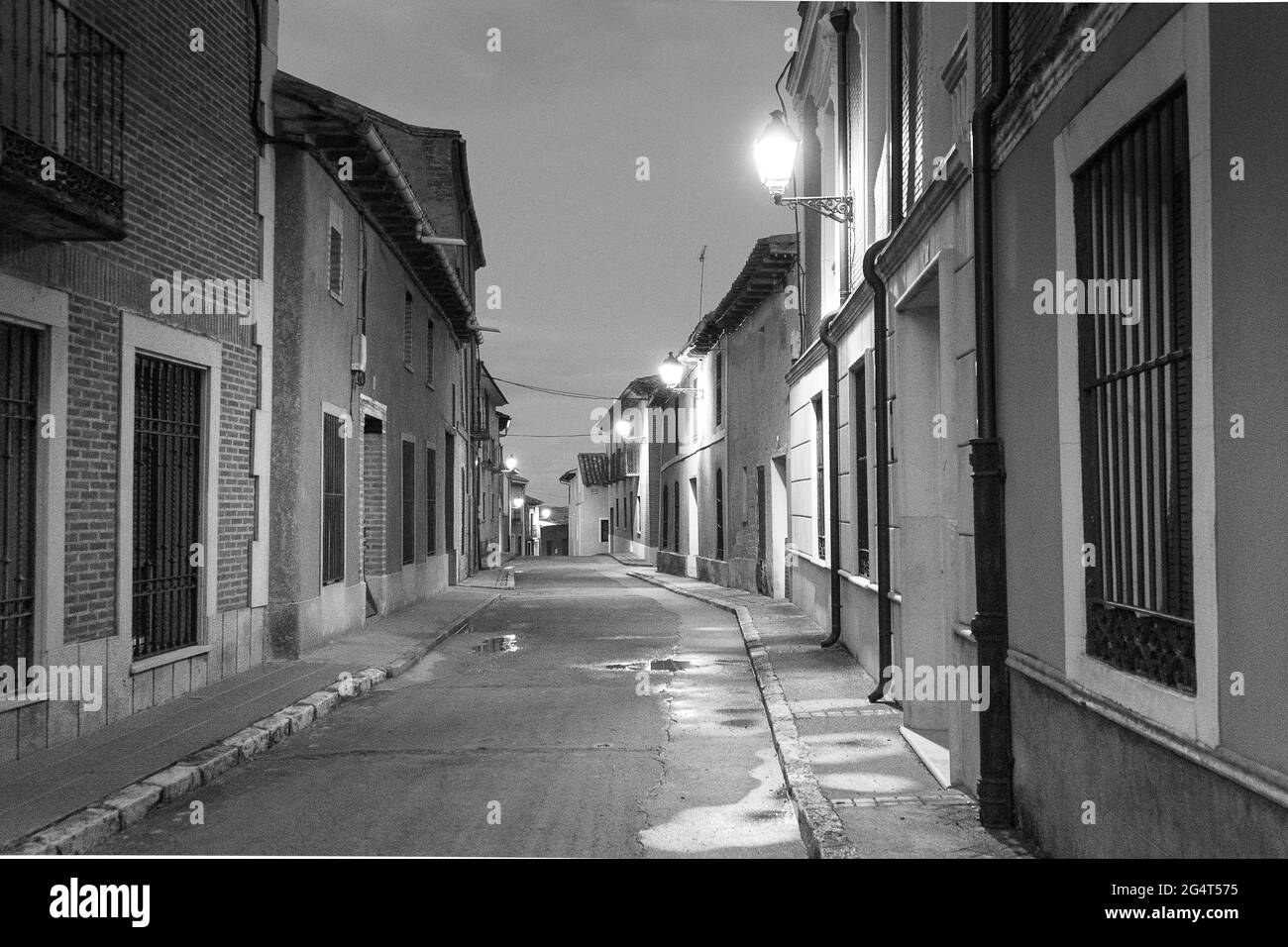 night street of an almost empty town Stock Photo - Alamy