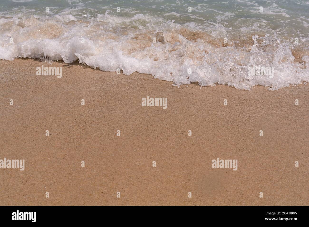 Close up tide bubble and wave of sea to beach Stock Photo - Alamy