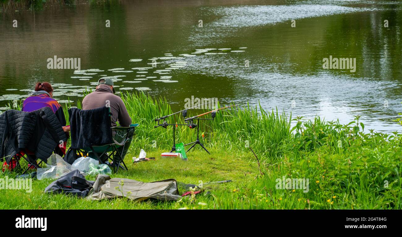 Spot of anglers beside a channel in the Netherlands Stock Photo - Alamy