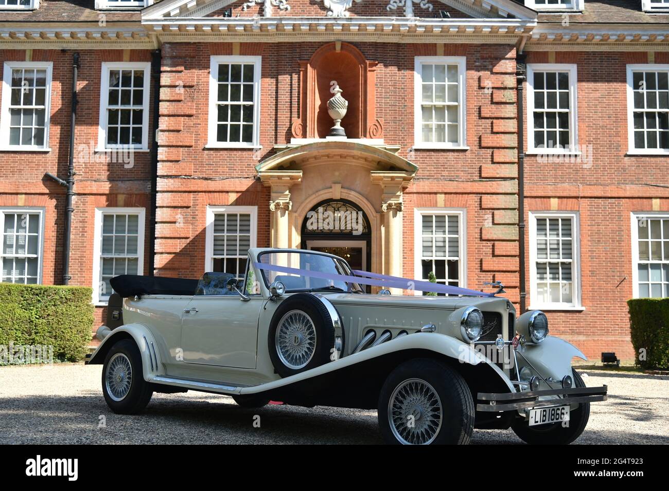 Classic Beaufort car outside mansion wedding venue Stock Photo - Alamy