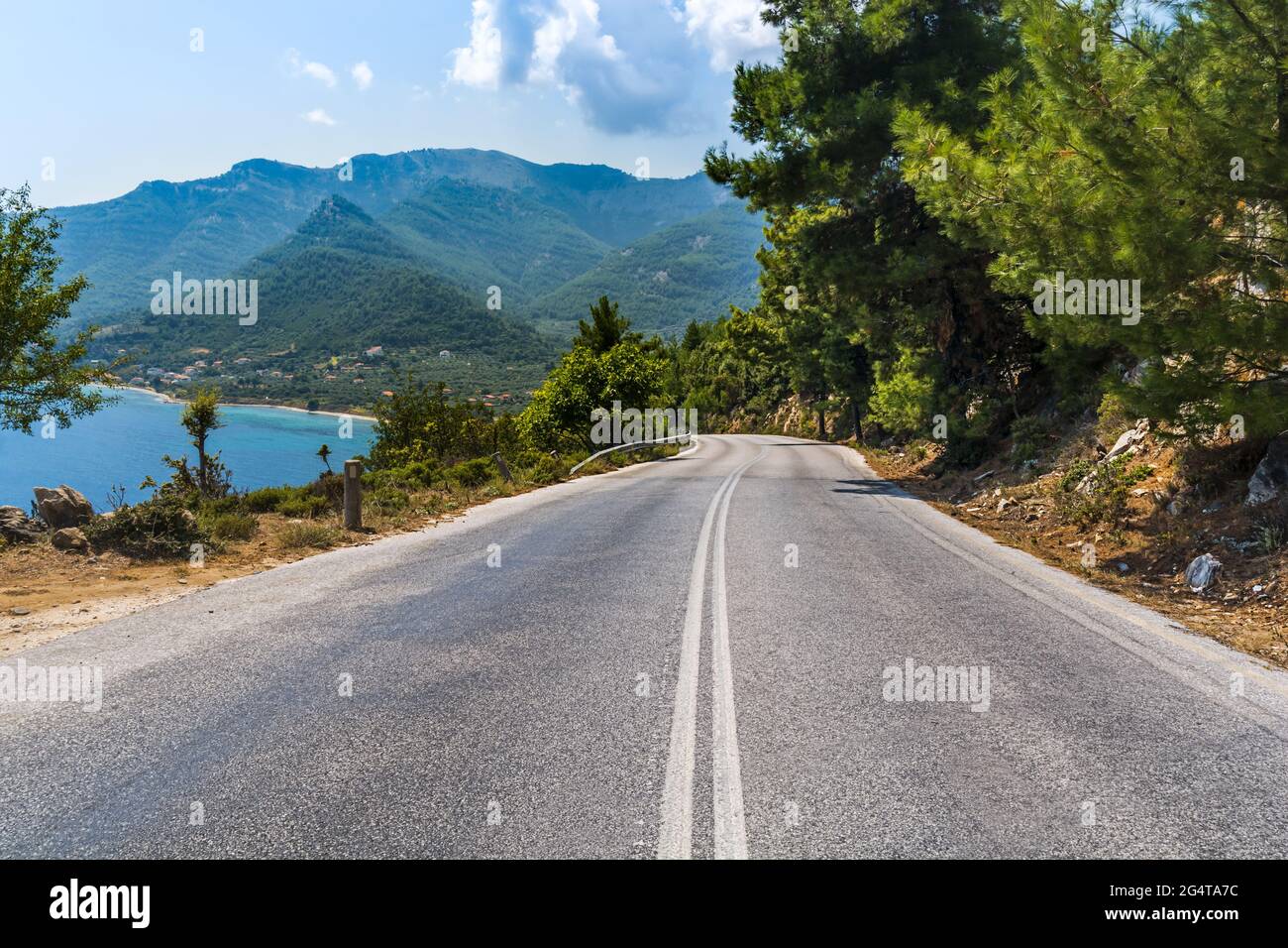 Open road running along water line of a sea Stock Photo - Alamy