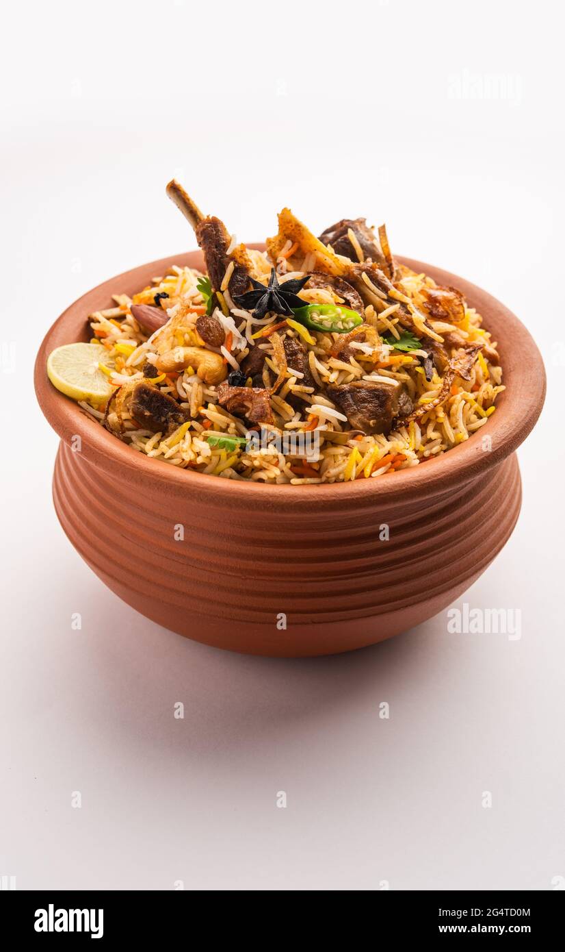 Dum Handi Mutton Biryani or gosht pilaf is prepared in an earthen or ...