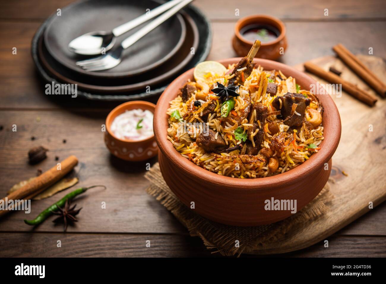 Dum Handi Mutton Biryani or gosht pilaf is prepared in an earthen or ...