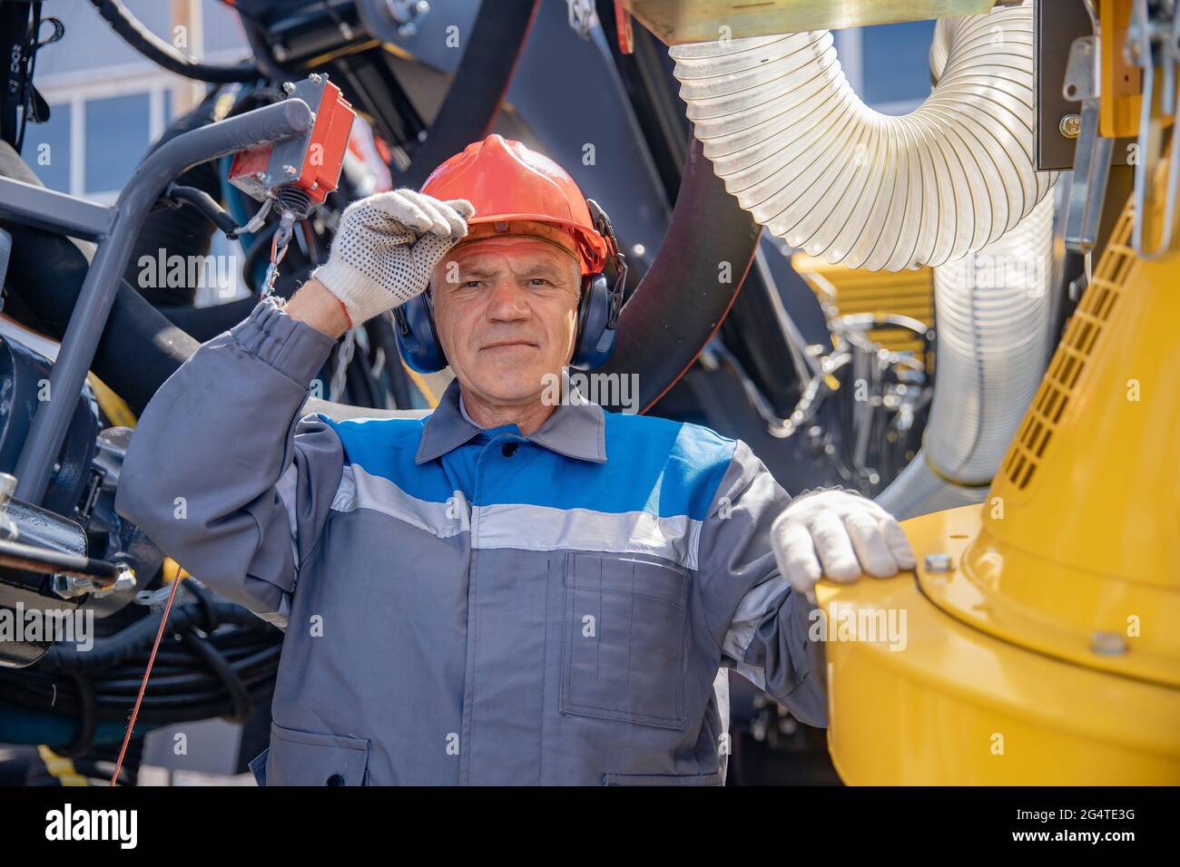 Electrical engineer worker maintains mining equipment for lowering into ...