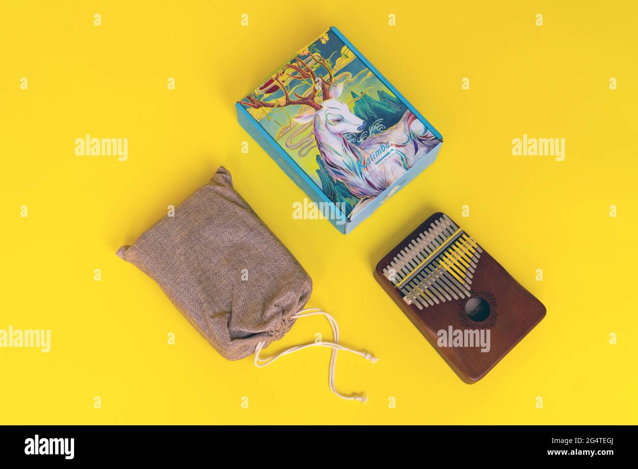 Unpacking kalimba: box, in a case and the instrument itself. Step 1 ...