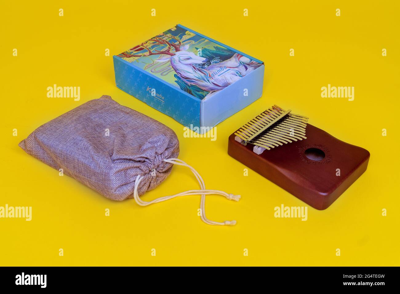 Unpacking kalimba: box, in a case and the instrument itself. Step 1 ...