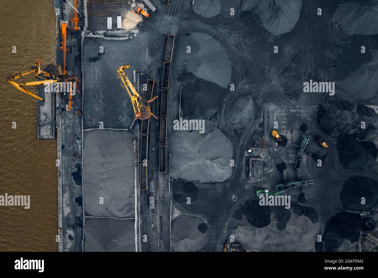 Loading and unloading coal on ship terminal sea cargo port, industrial ...