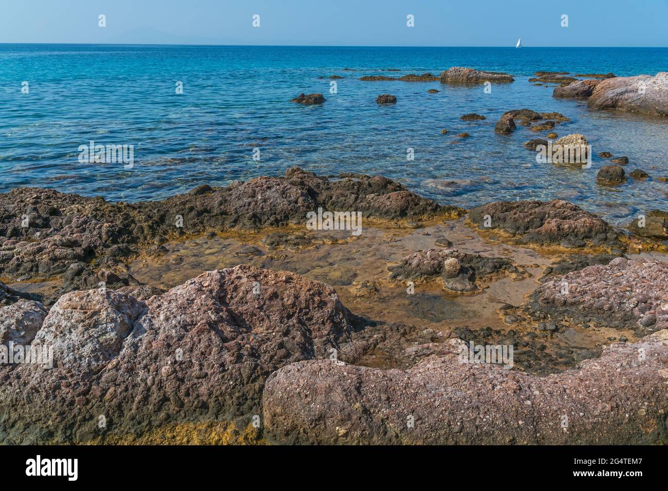 Sea shore stone coastline with clear sky Stock Photo - Alamy
