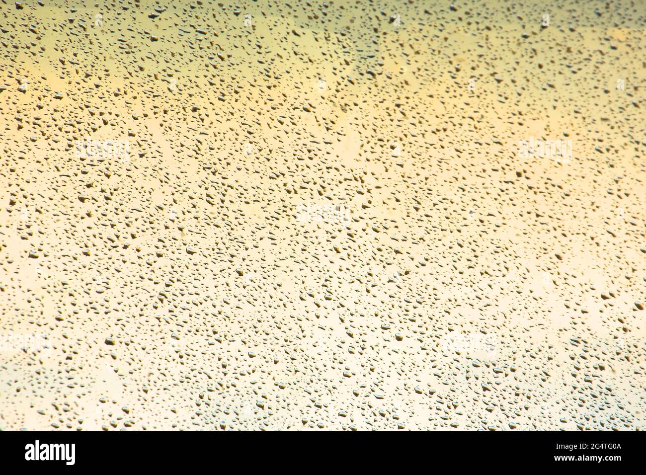 Rain drops on window glasses surface with warm shade background Stock ...