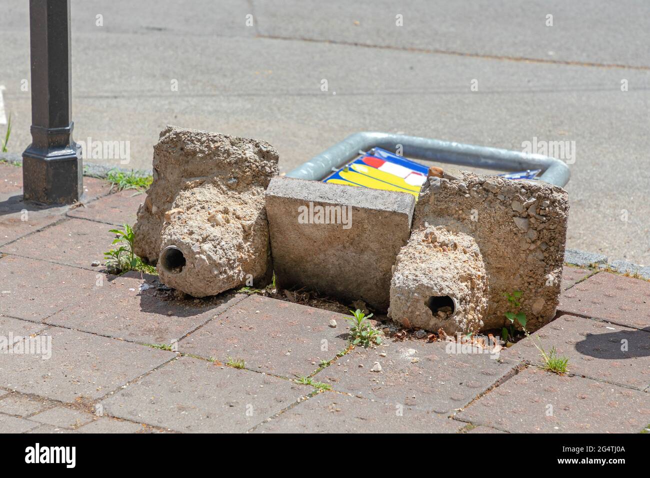 Street Sign Pulled Out From Concrete Foundation Damage Stock Photo - Alamy