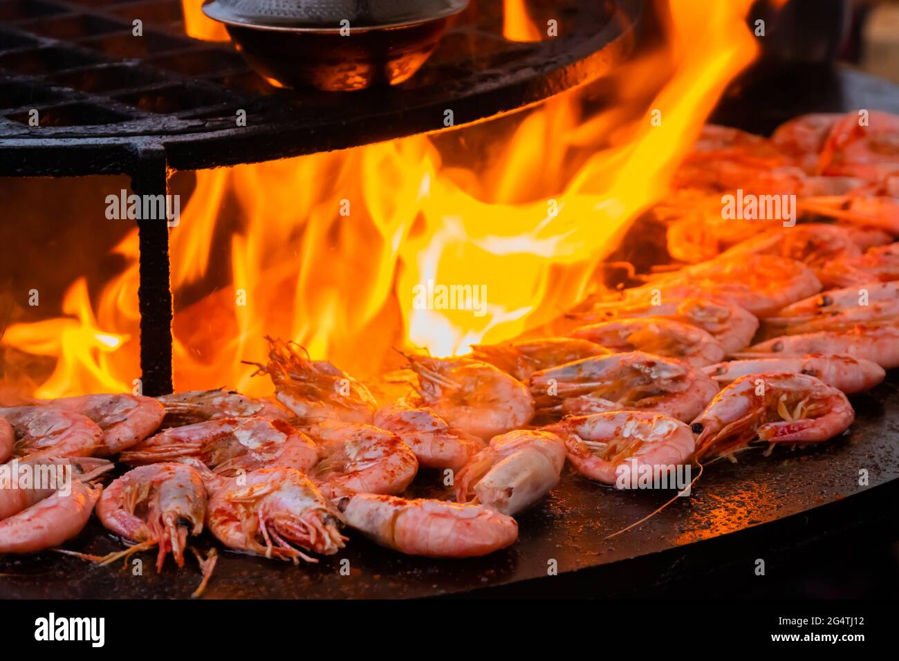 Process of grilling red king prawns on brazier with hot flame Stock ...