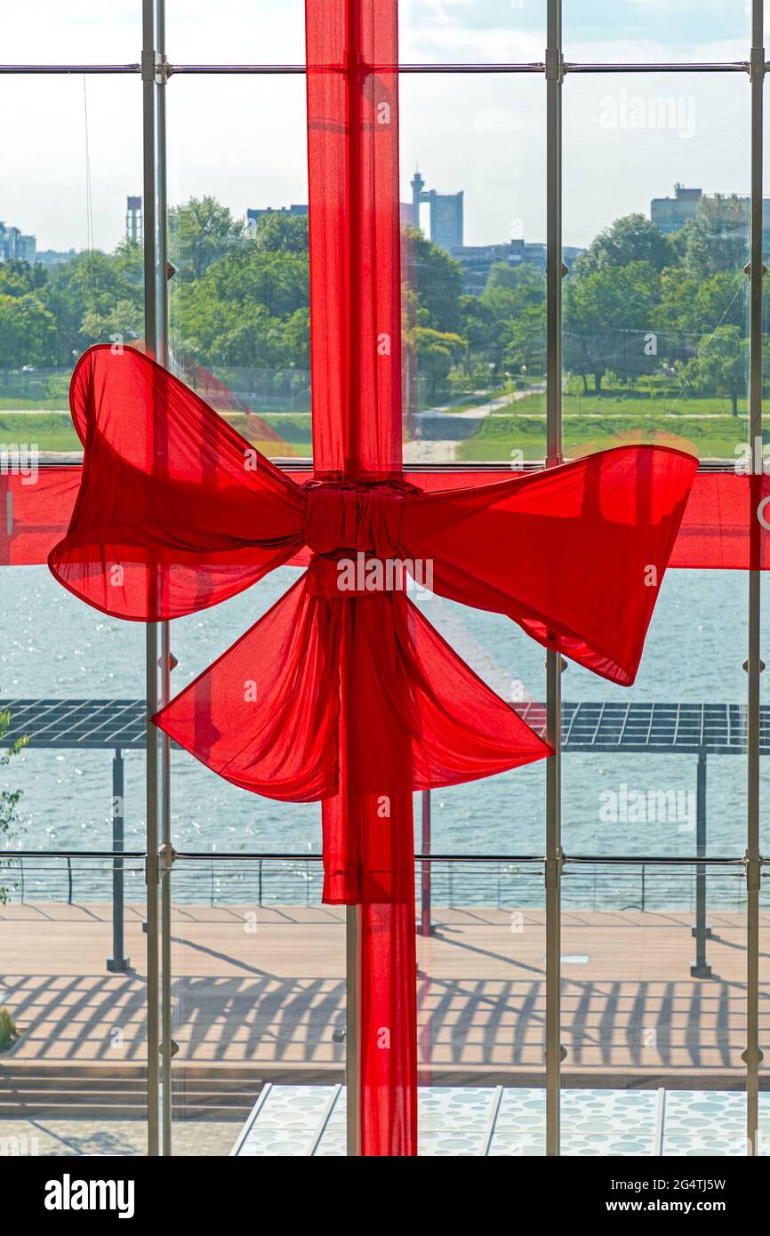 Red Bow Ribbon at Big Windows for Opening Celebration Stock Photo - Alamy