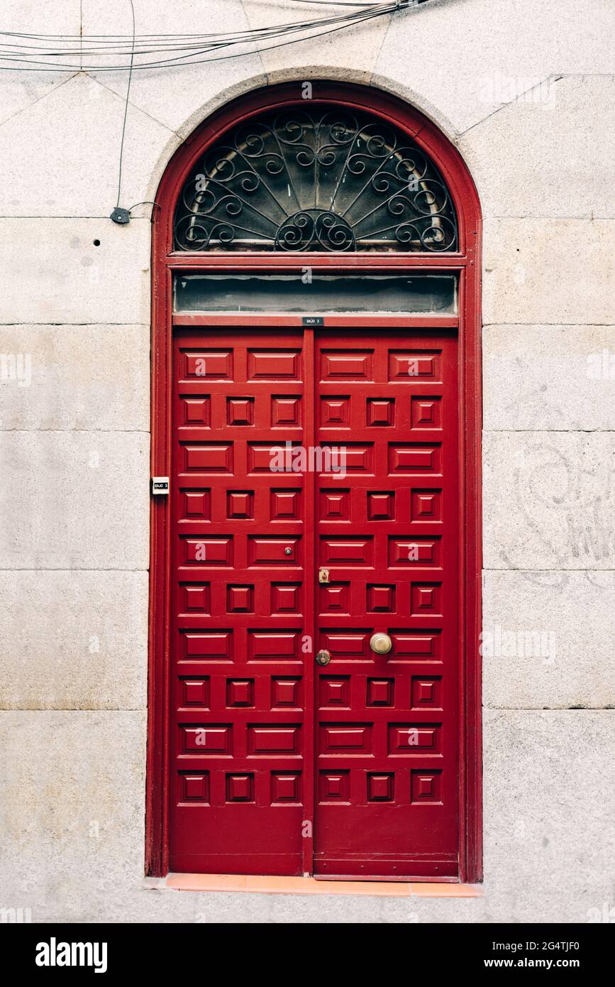 Red Entrance Door to Residential Building with Stone Facade. Lavapies ...