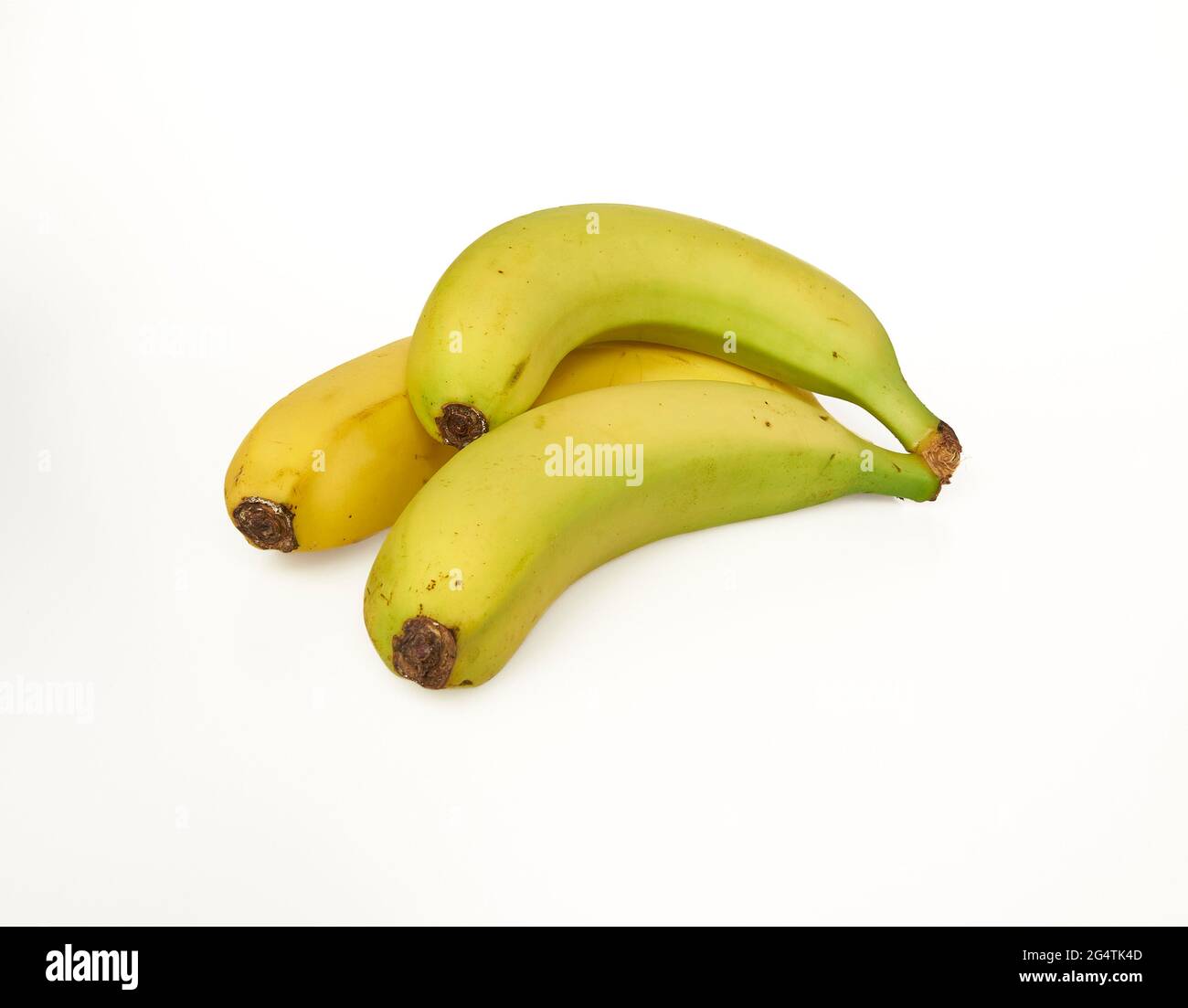 three bananas on a white background Stock Photo - Alamy