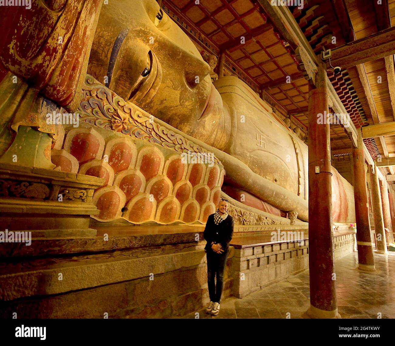 Wangye, China. 23rd June, 2021. Tourists look at Nibbana of Sakyamuni ...