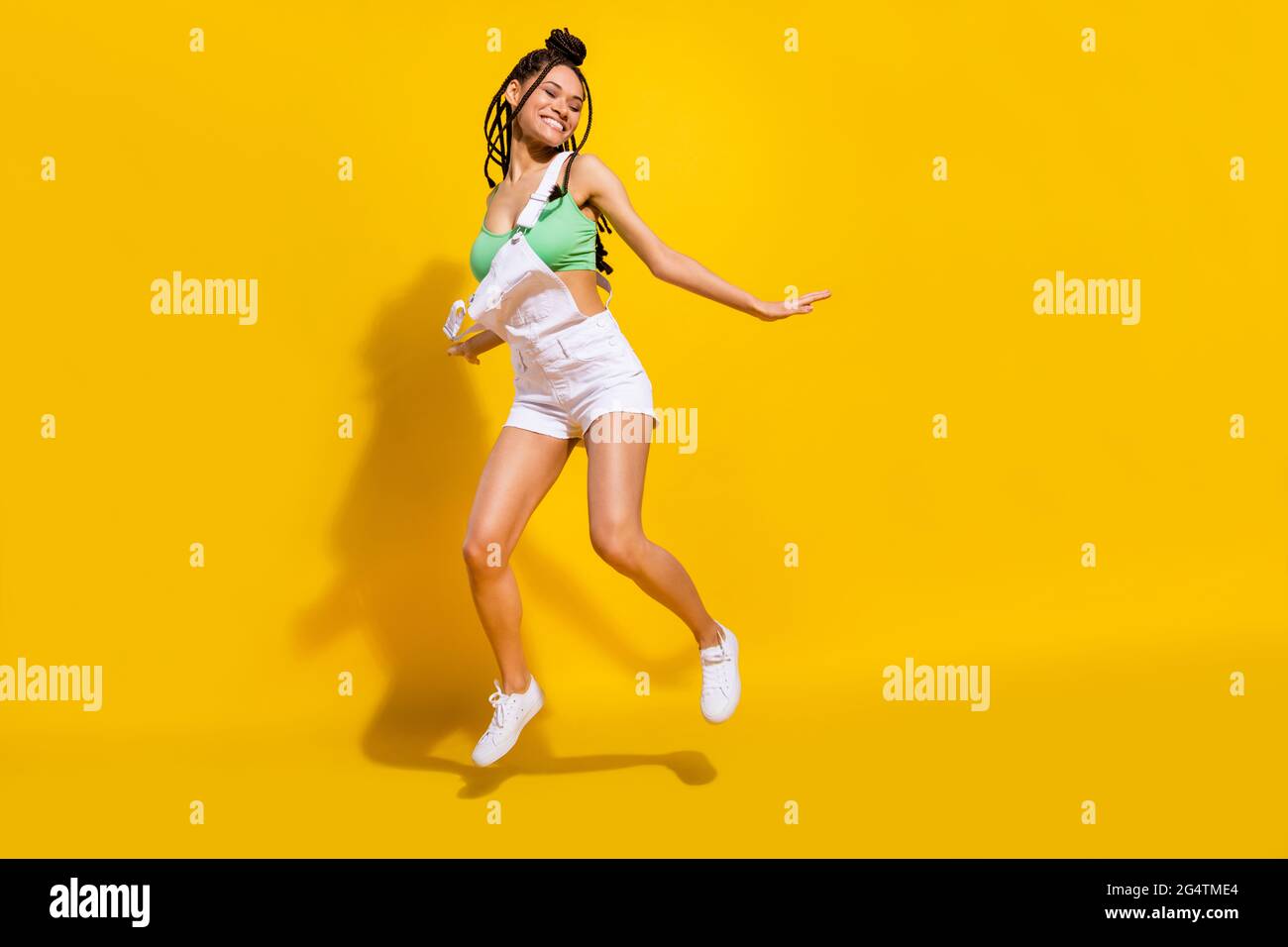 Full size photo of afro american charming happy young woman jump up ...