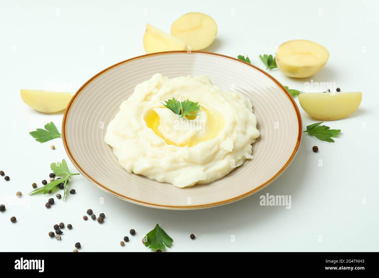 Plate of mashed potatoes and ingredients on white background Stock ...