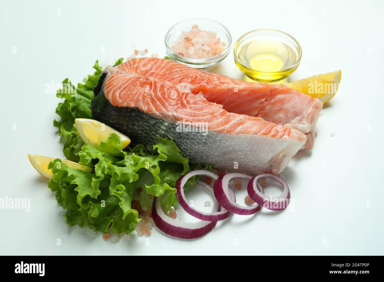 Concept of cooking salmon on white background Stock Photo - Alamy