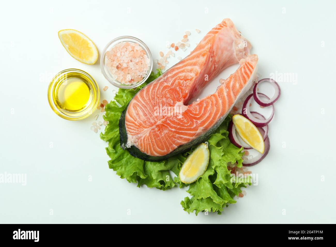 Concept of cooking salmon on white background Stock Photo - Alamy