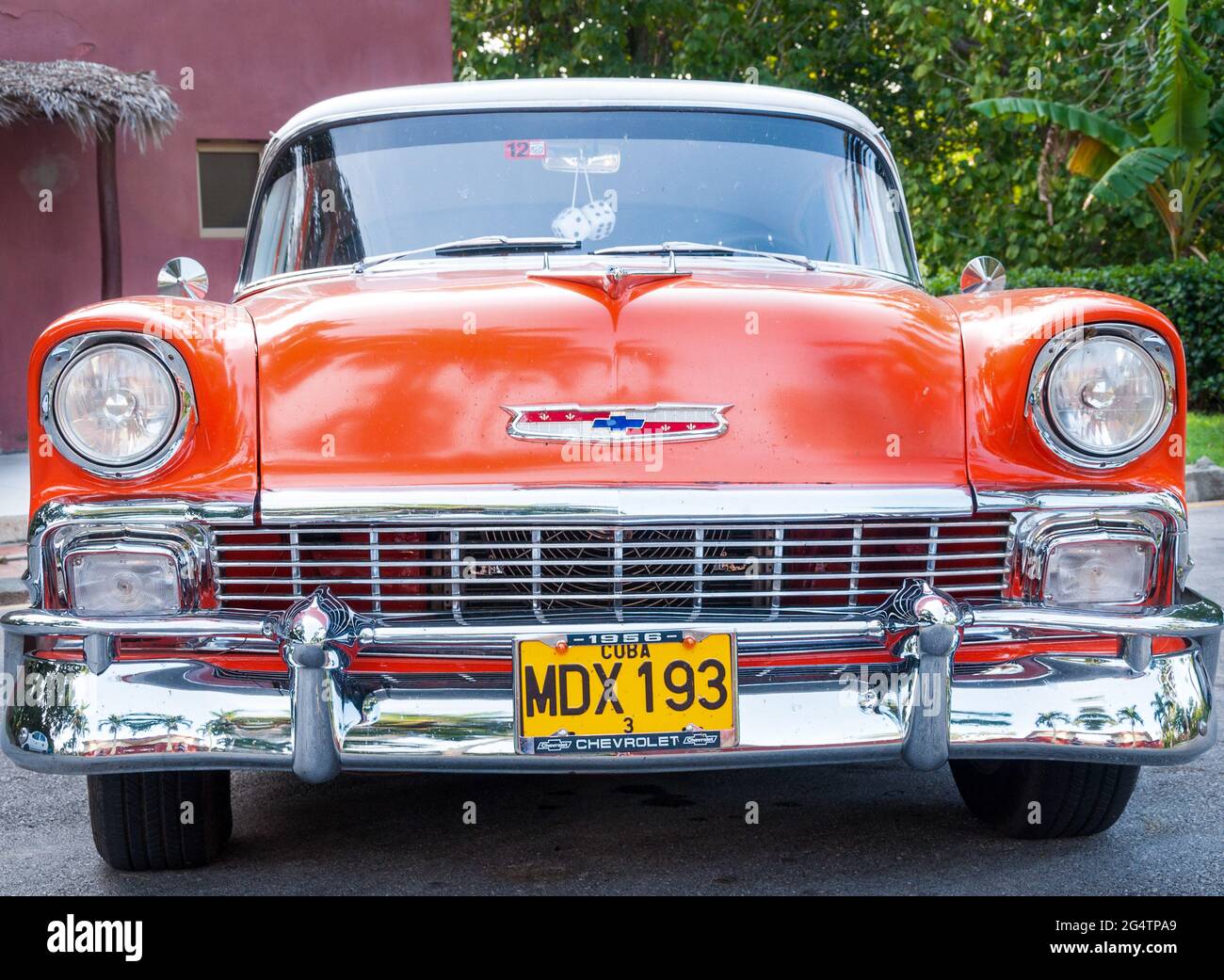 Orange vintage Chevrolet 57, red-orange vintage Chevrolet car with ...
