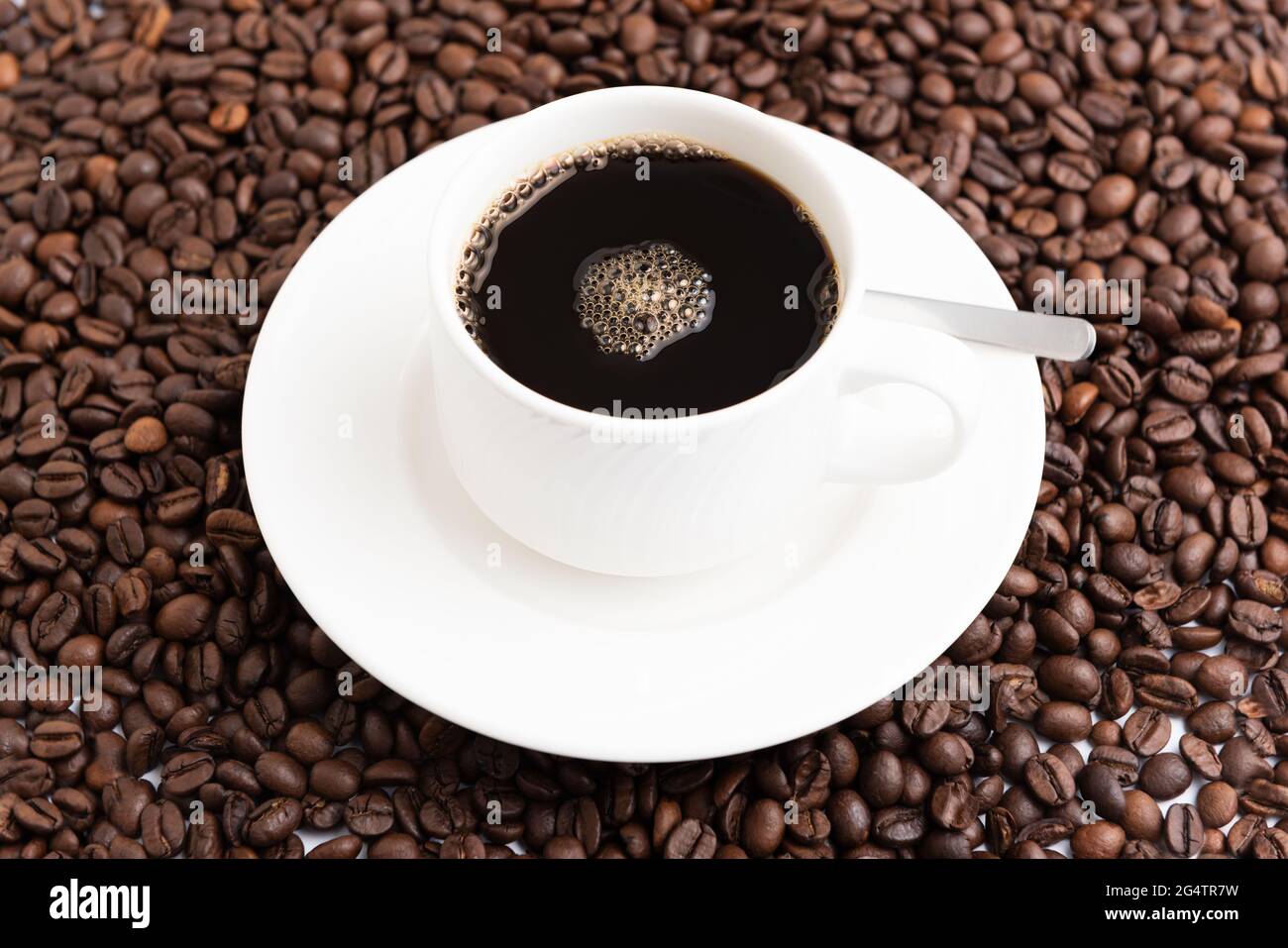 Coffee mug with plate and spoon side view Stock Photo - Alamy